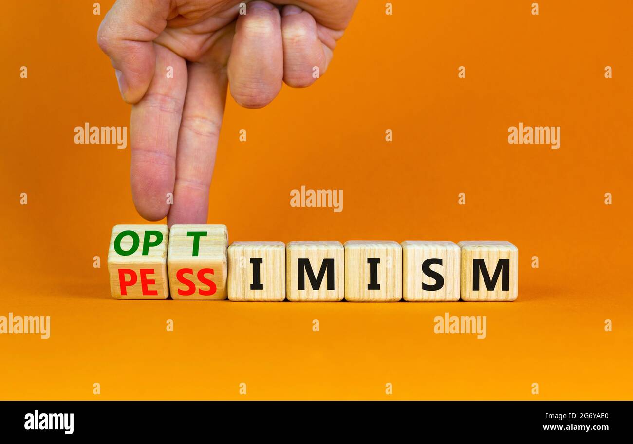 Pessimism or optimism symbol. Businessman turns cubes and changes the ...