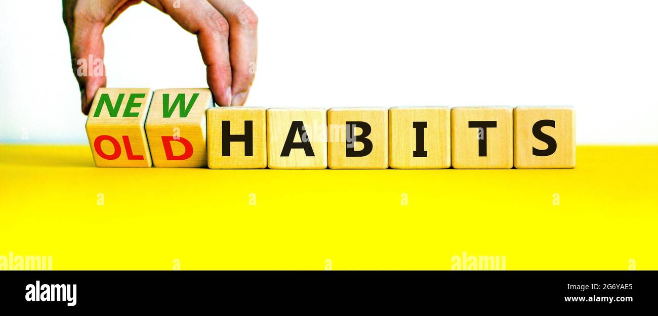 New or old habits symbol. Businessman turns wooden cubes and changes ...