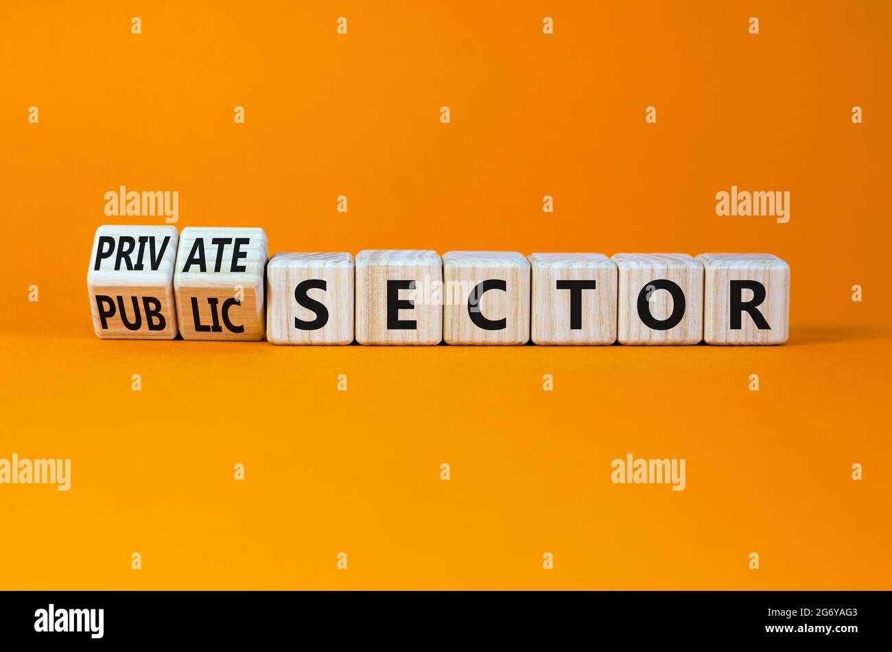 Private or public sector symbol. Turned wooden cubes, changed words ...