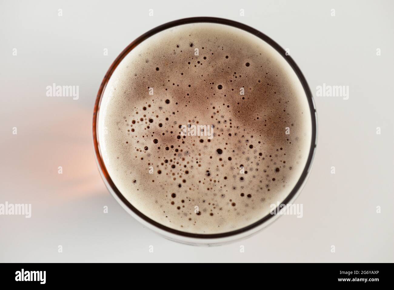 Beer in a pint glass viewed from above Stock Photo - Alamy