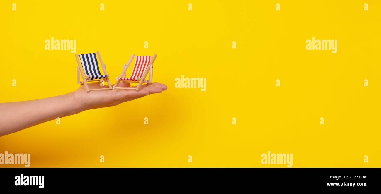 sunbeds on hand, tropical vacation, panoramic layout over yellow ...