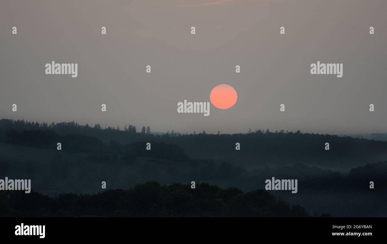 Full moon over a landscape Stock Photo - Alamy