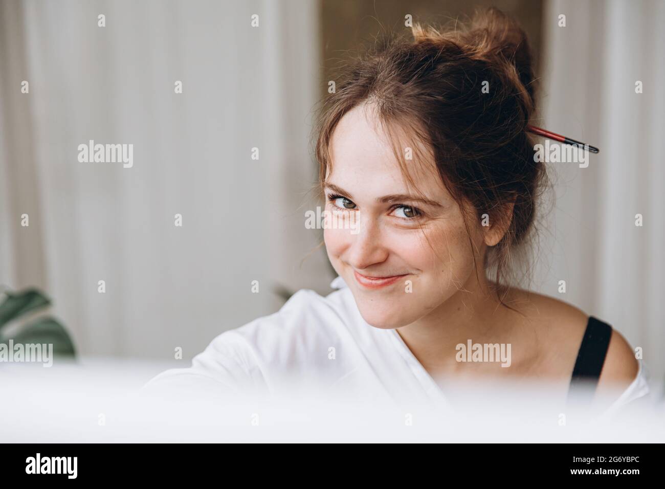 Portrait of talented woman painting on canvas Stock Photo - Alamy