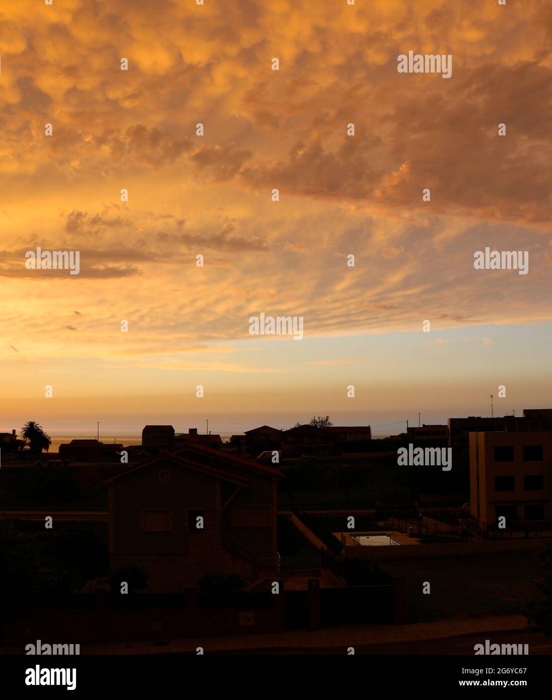 Sunset with extreme colours and urban silhouette Stock Photo - Alamy