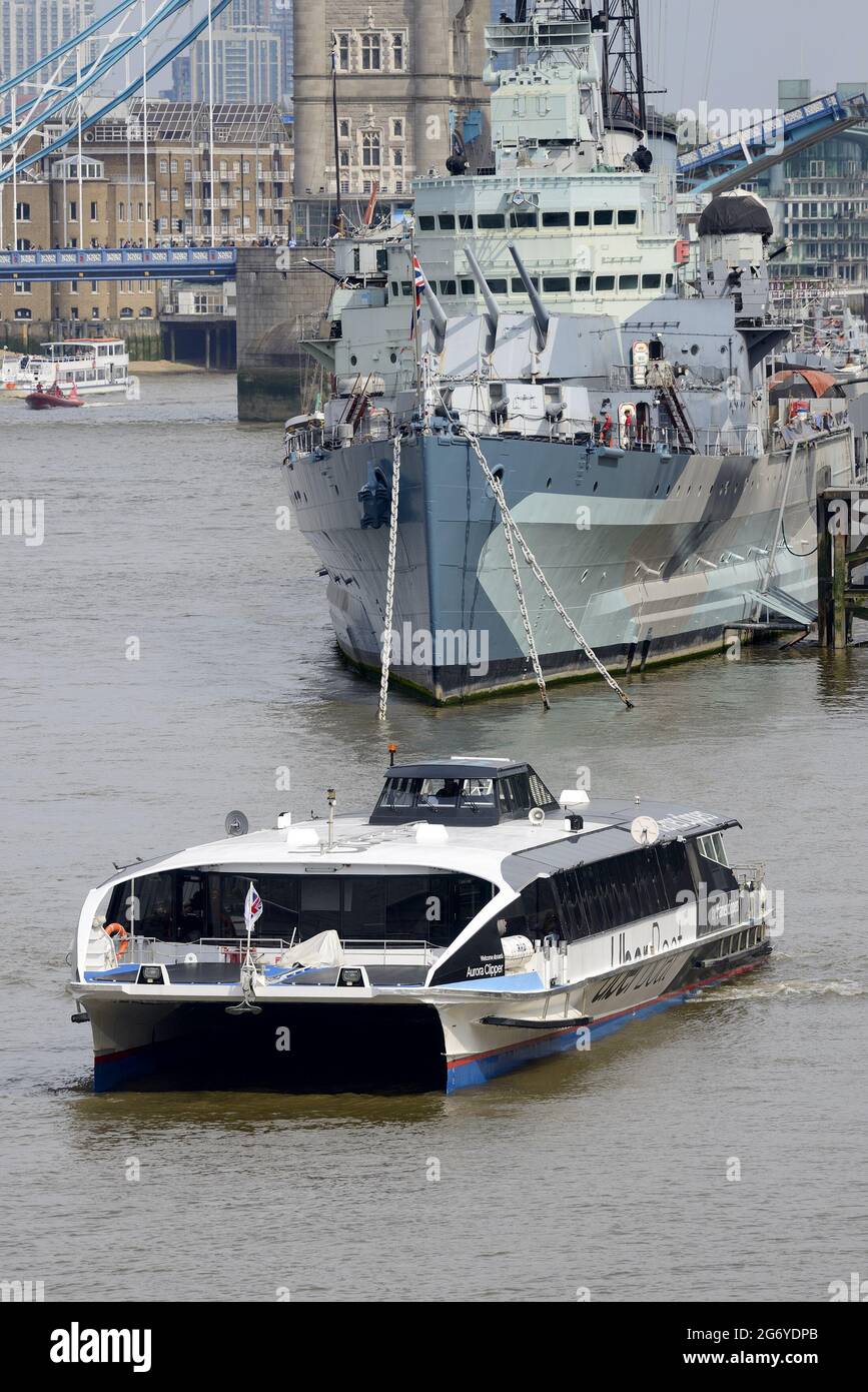 London, England, UK. Uber Boat / Thames Clipper, near HMS Belfast ...