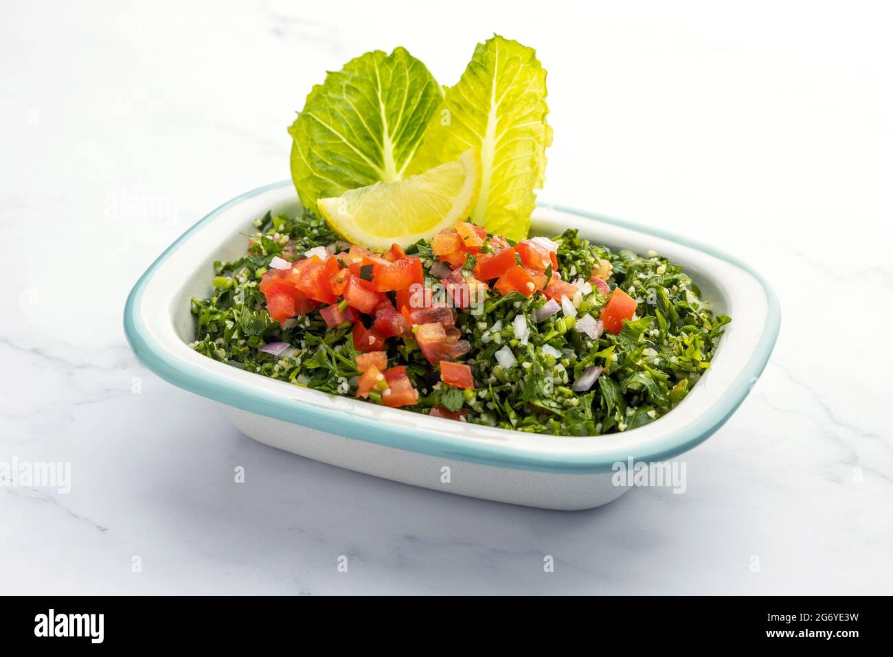 Traditional Arabic Salad Tabbouleh isolated on a marble backdrop Stock ...