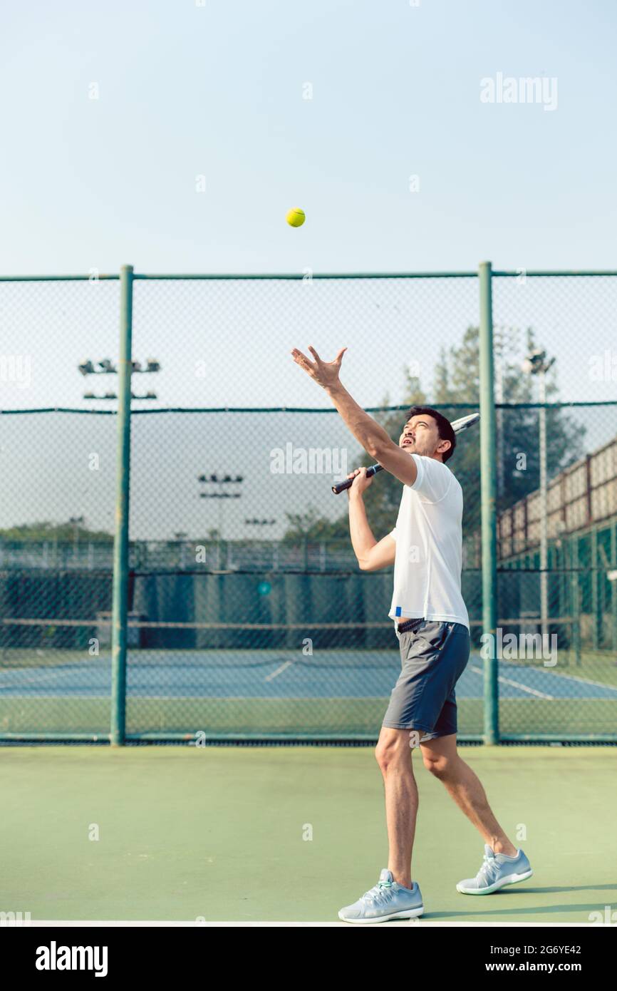 Portrait of determined tennis player looking forward with concentration ...