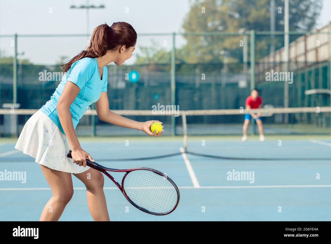 Side view of a professional female player smiling while holding the ...