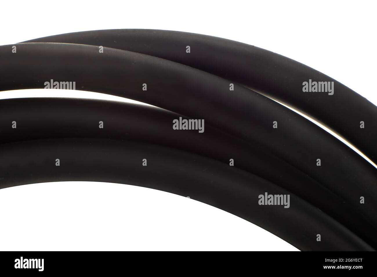 Closeup shot of rolled black electrical wire isolated on a white ...
