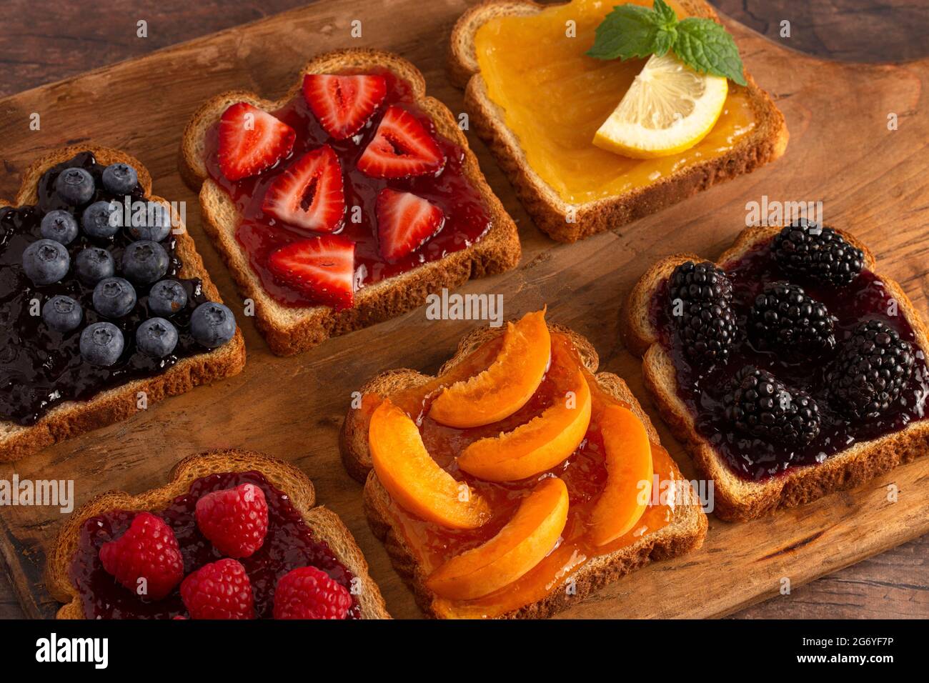 Six Pieces of Fruit Toast on a Wooden Cutting Board Stock Photo - Alamy
