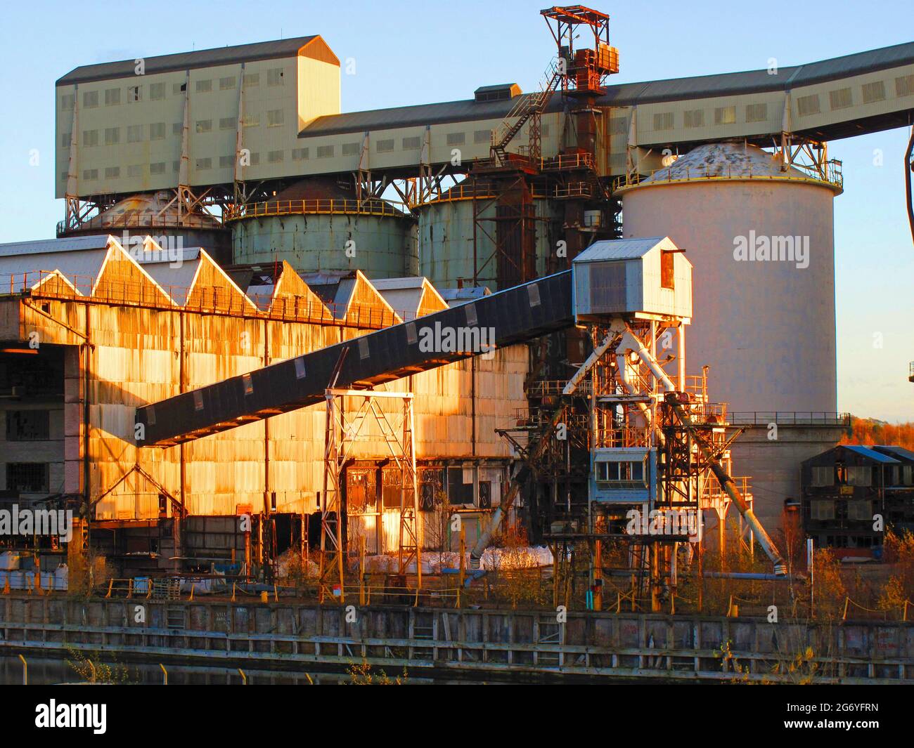 Industrial complex, with storage facilities, sunset Stock Photo - Alamy