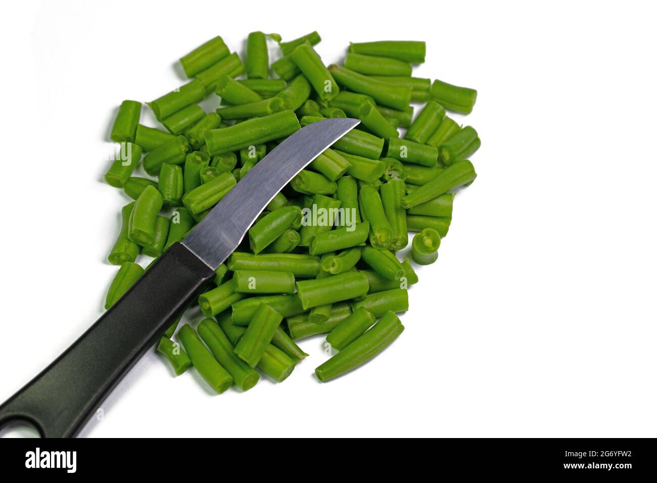 Green beans, cut, against white background Stock Photo - Alamy