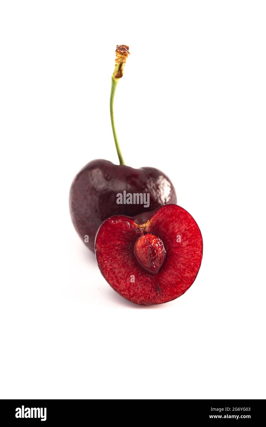 A Cherry and Cut Cherry Isoalted on a White Background Stock Photo - Alamy