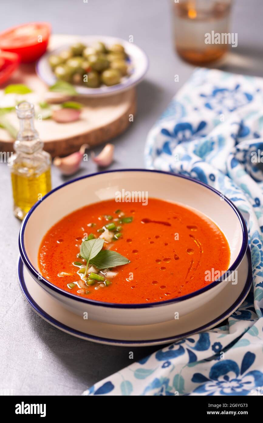 A plate of traditional Spanish gazpacho with tomato, pepper, garlic and ...