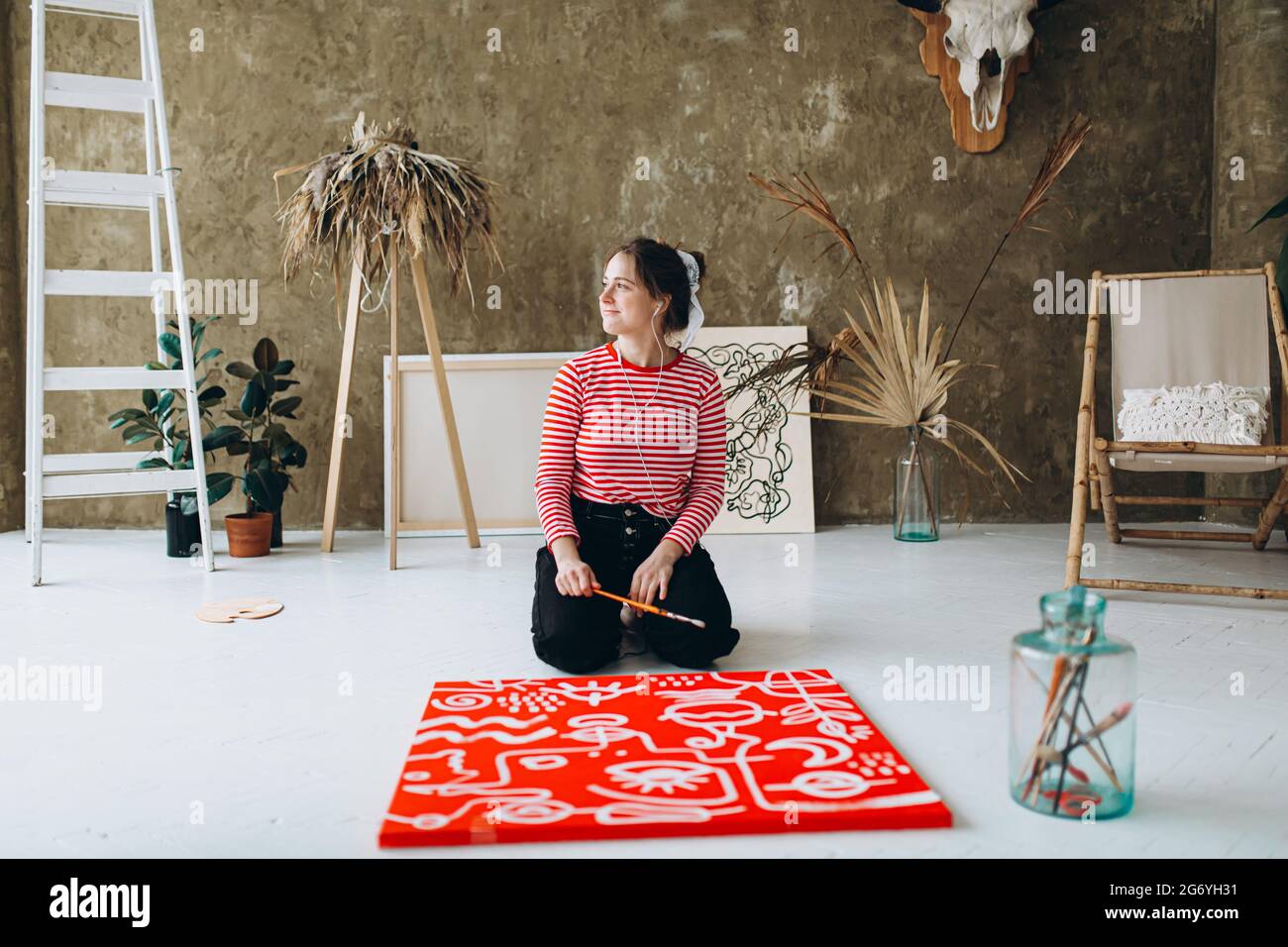 Talented painter listening songs and creating at studio Stock Photo - Alamy