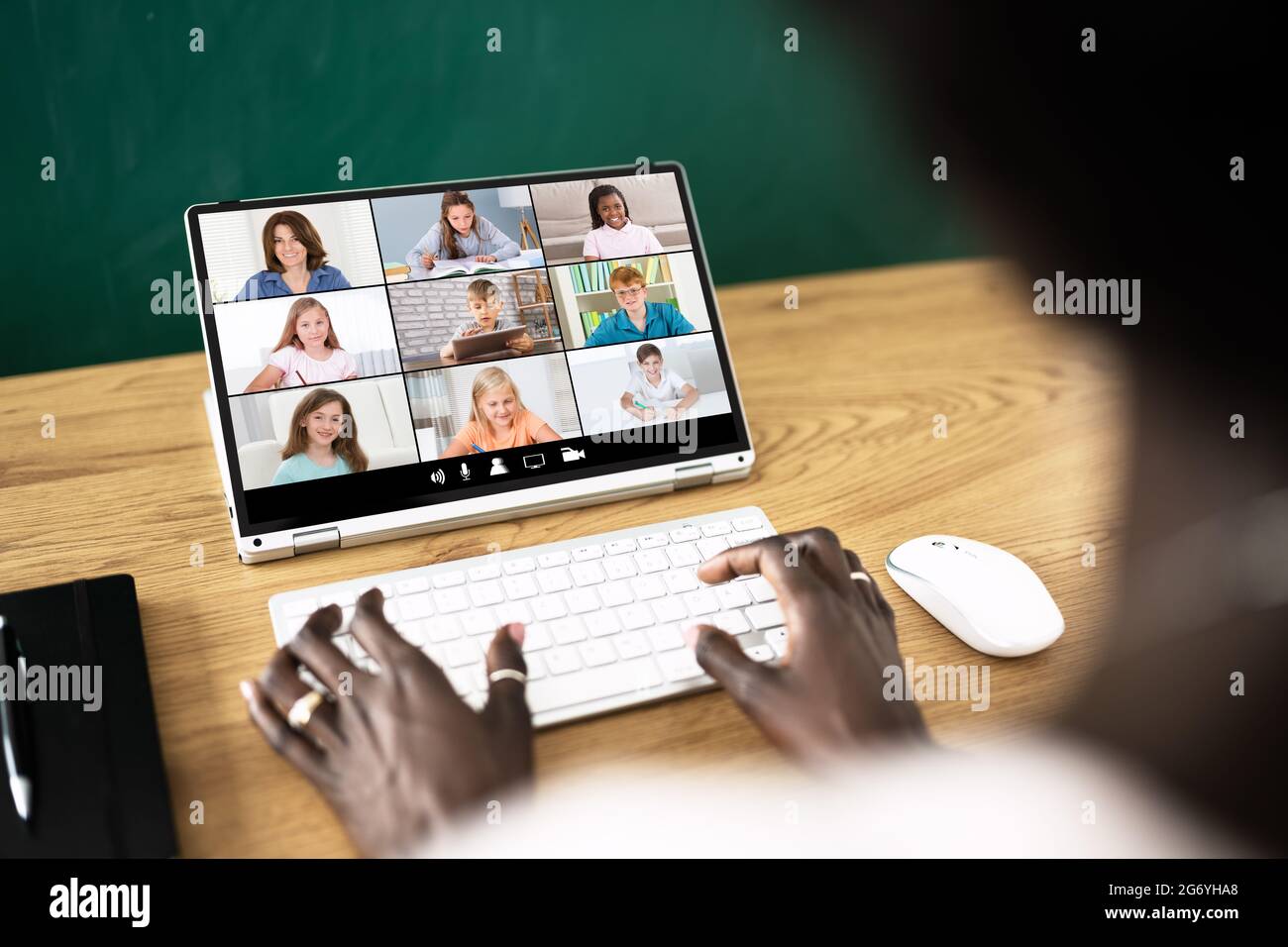 Teacher Hosting Online Class Using Video Conference On Laptop Stock ...