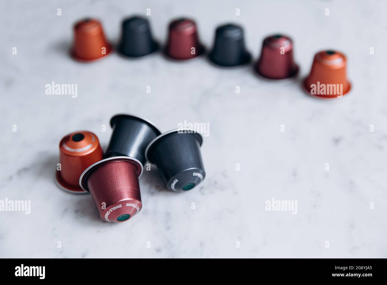 Variety of coffee capsules on white background Stock Photo - Alamy