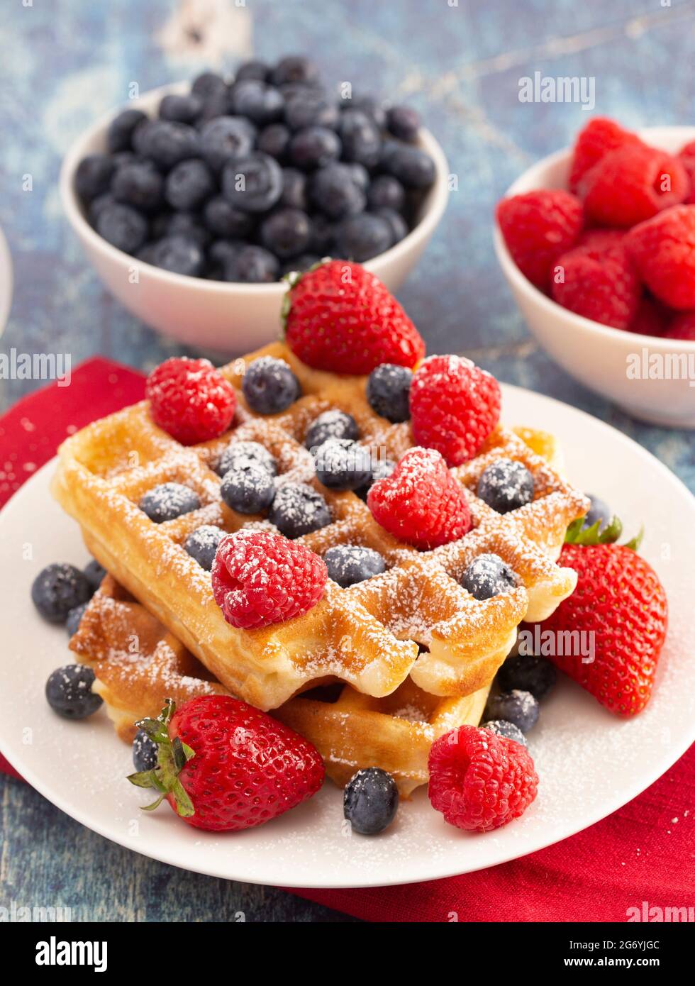 Classic Berry Waffles on a Rustic Blue Wood Table Stock Photo - Alamy