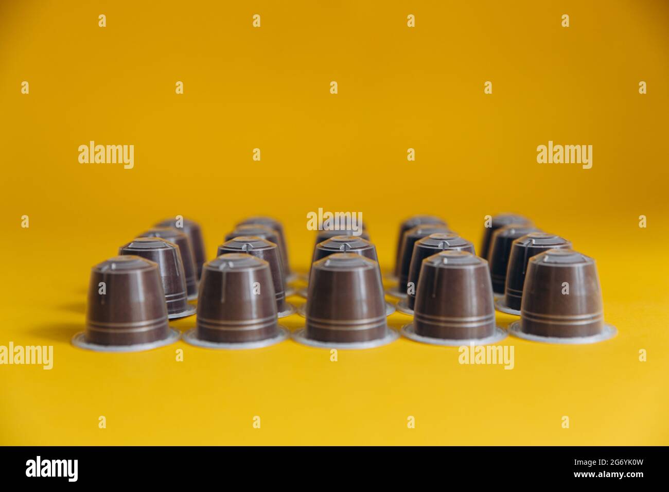 Disposable coffee capsules lying in rows Stock Photo - Alamy