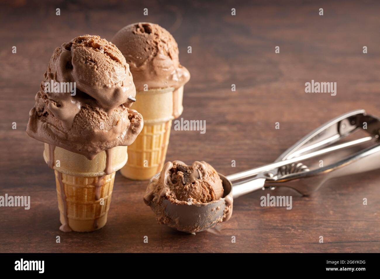Chocolate Ice Cream Cone on a Rustic Wooden Table Stock Photo - Alamy
