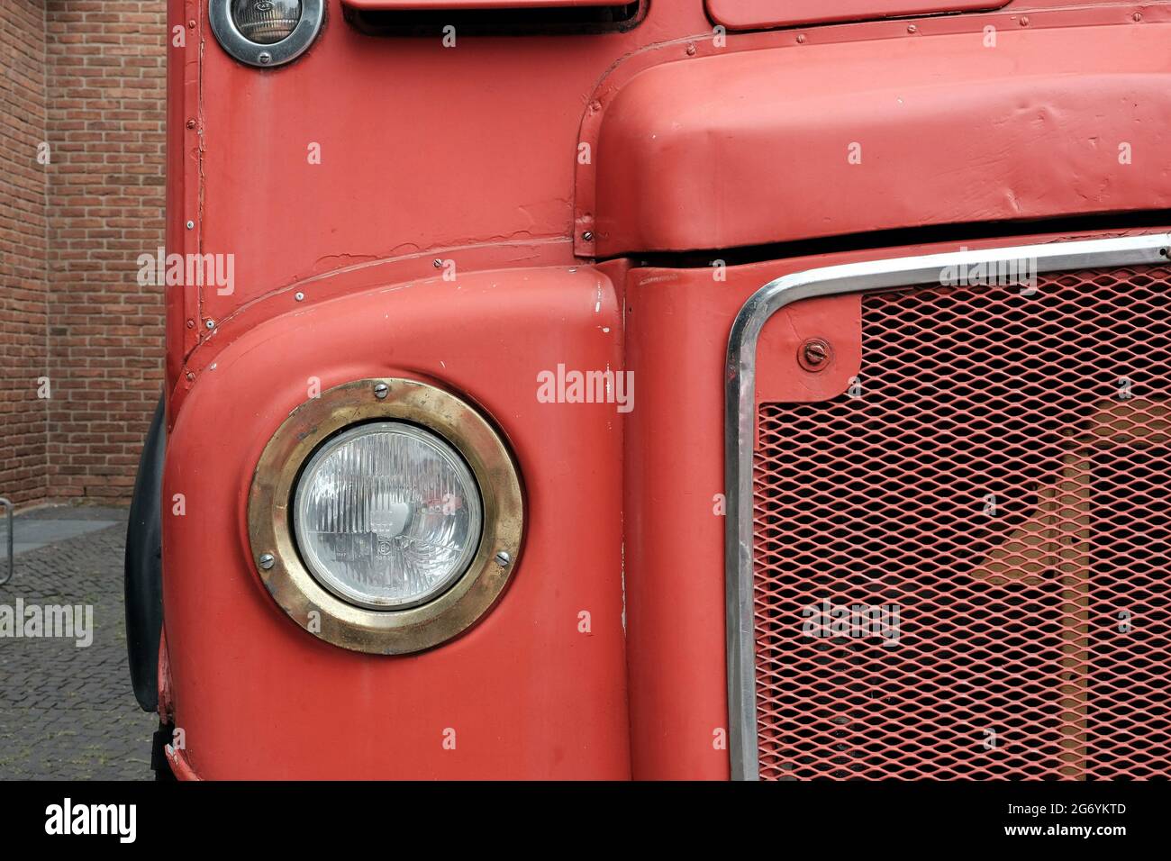 Closeup front view of a retro matte red car's headlights Stock Photo ...