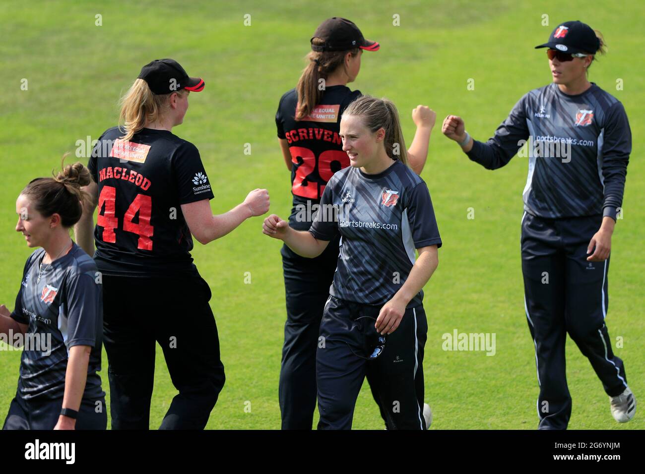 Emma Lamb touches fists with the Sunrisers team after a good victory ...