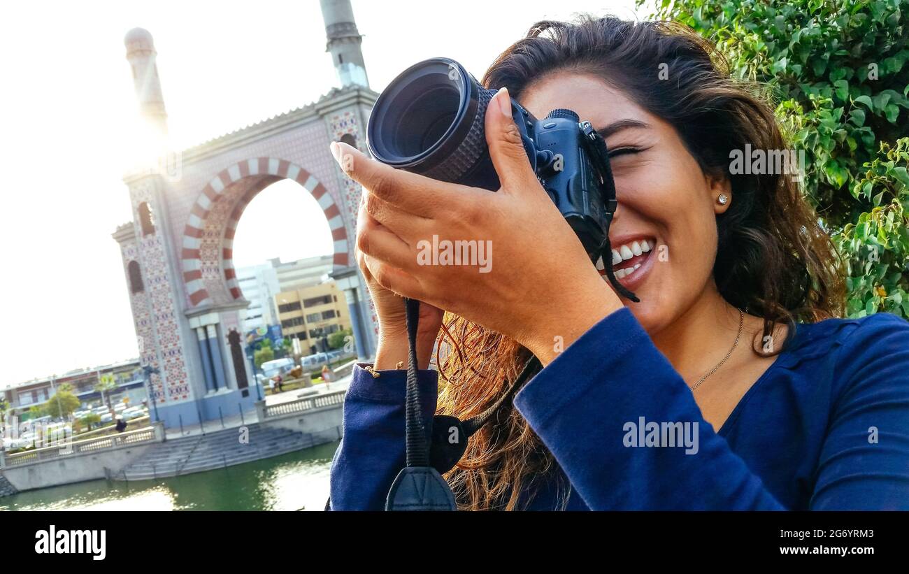 Pretty woman professional photographer camera hi-res stock photography ...