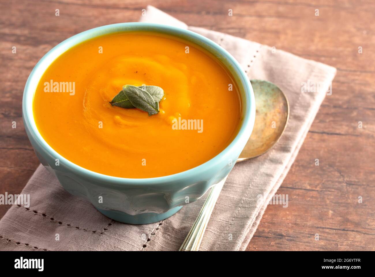Healthy Sweet Potato and Sage Soup on a Rustic Wooden Table Stock Photo ...