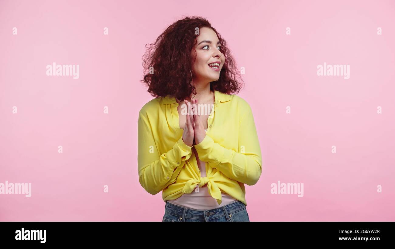 cheerful young woman clapping hands isolated on pink Stock Photo - Alamy