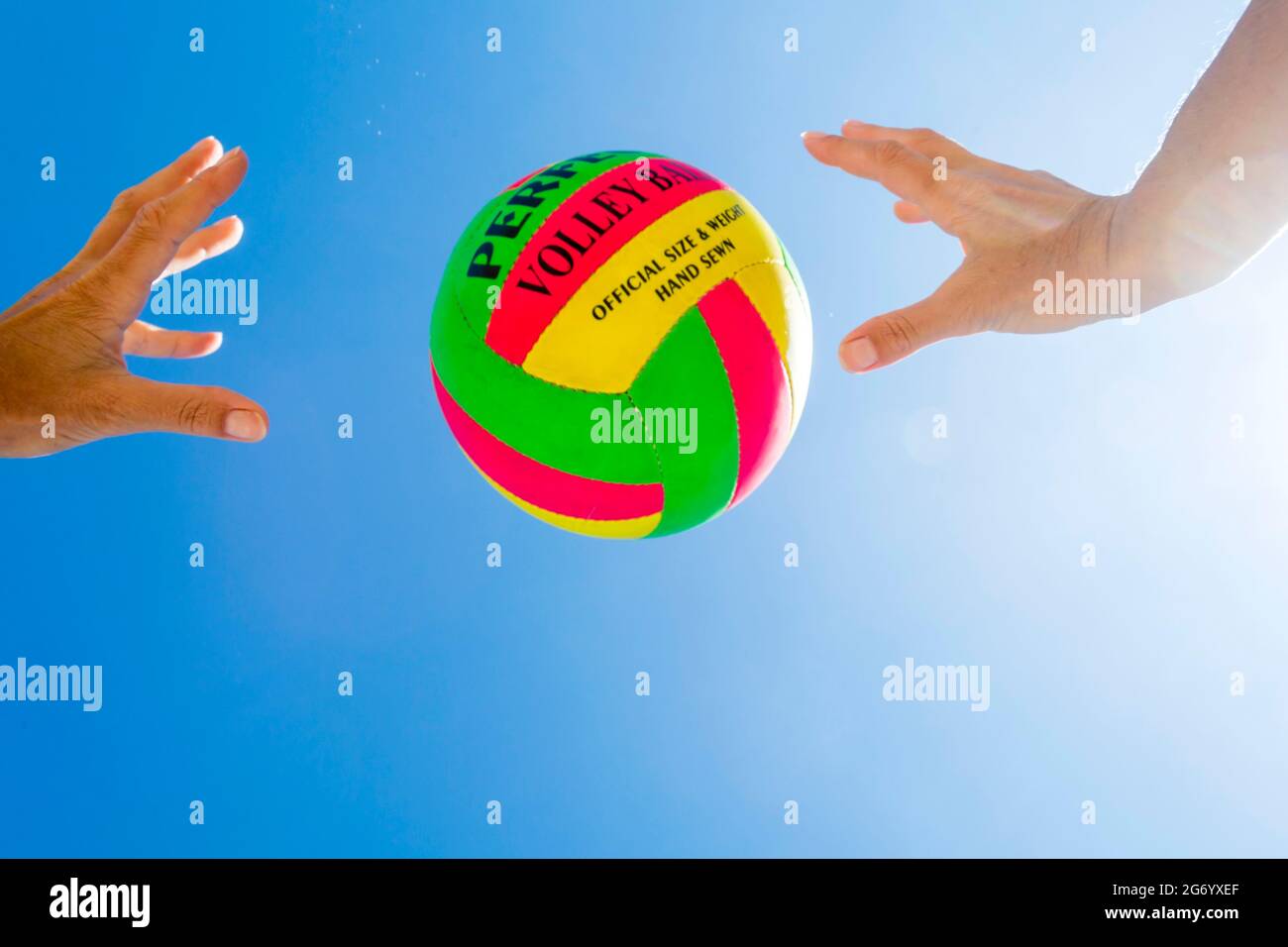 Hands receiving beach volleyball ball hi-res stock photography and ...