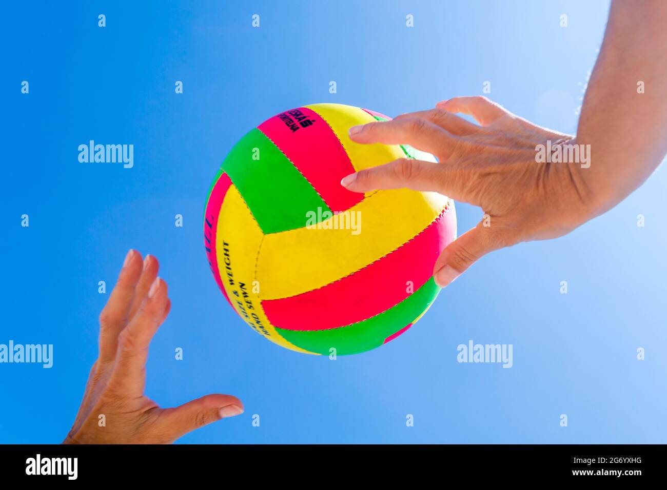 Hands receiving beach volleyball ball hi-res stock photography and ...