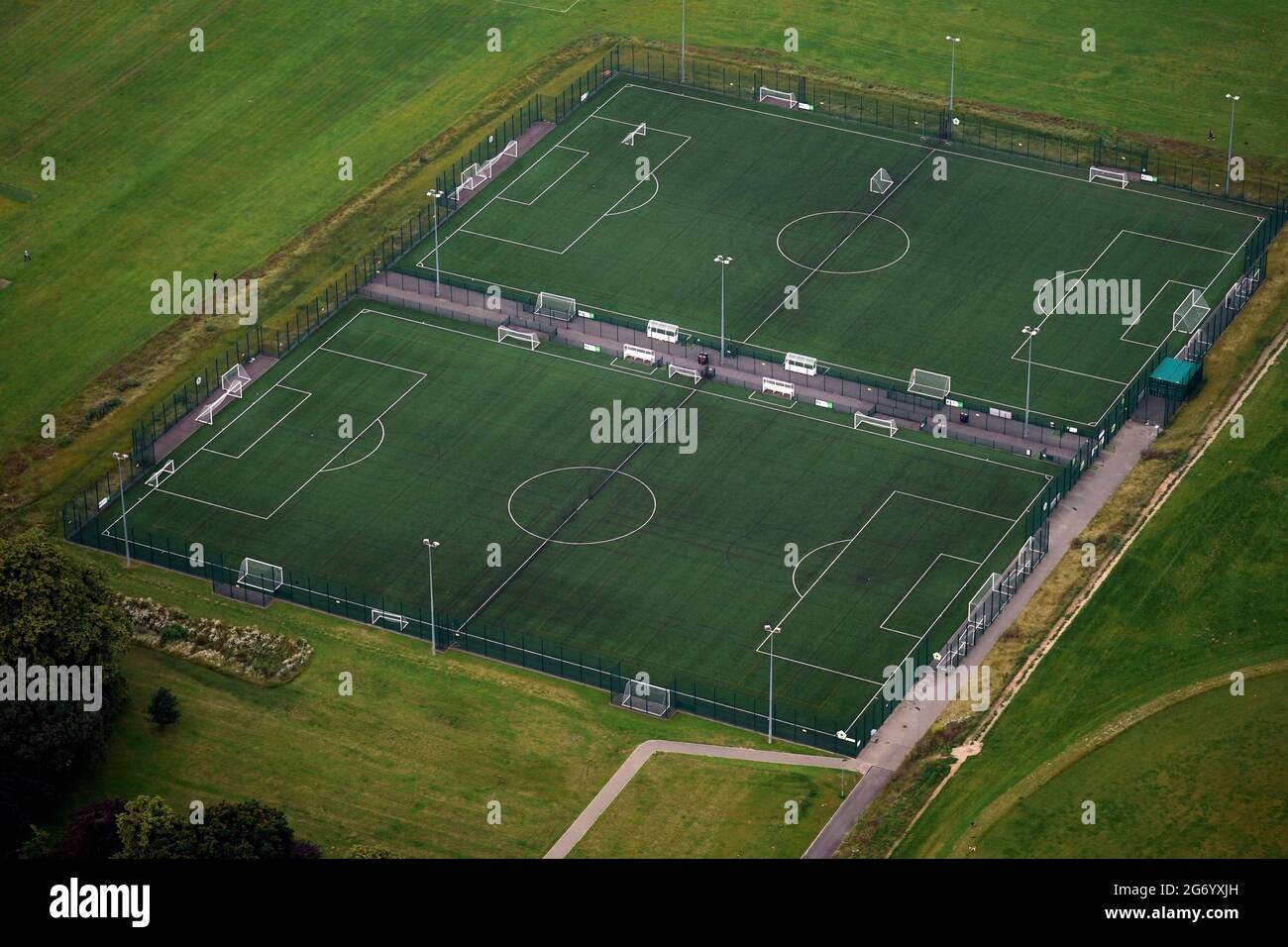 An aerial view of two football pitches in a park in west London ...