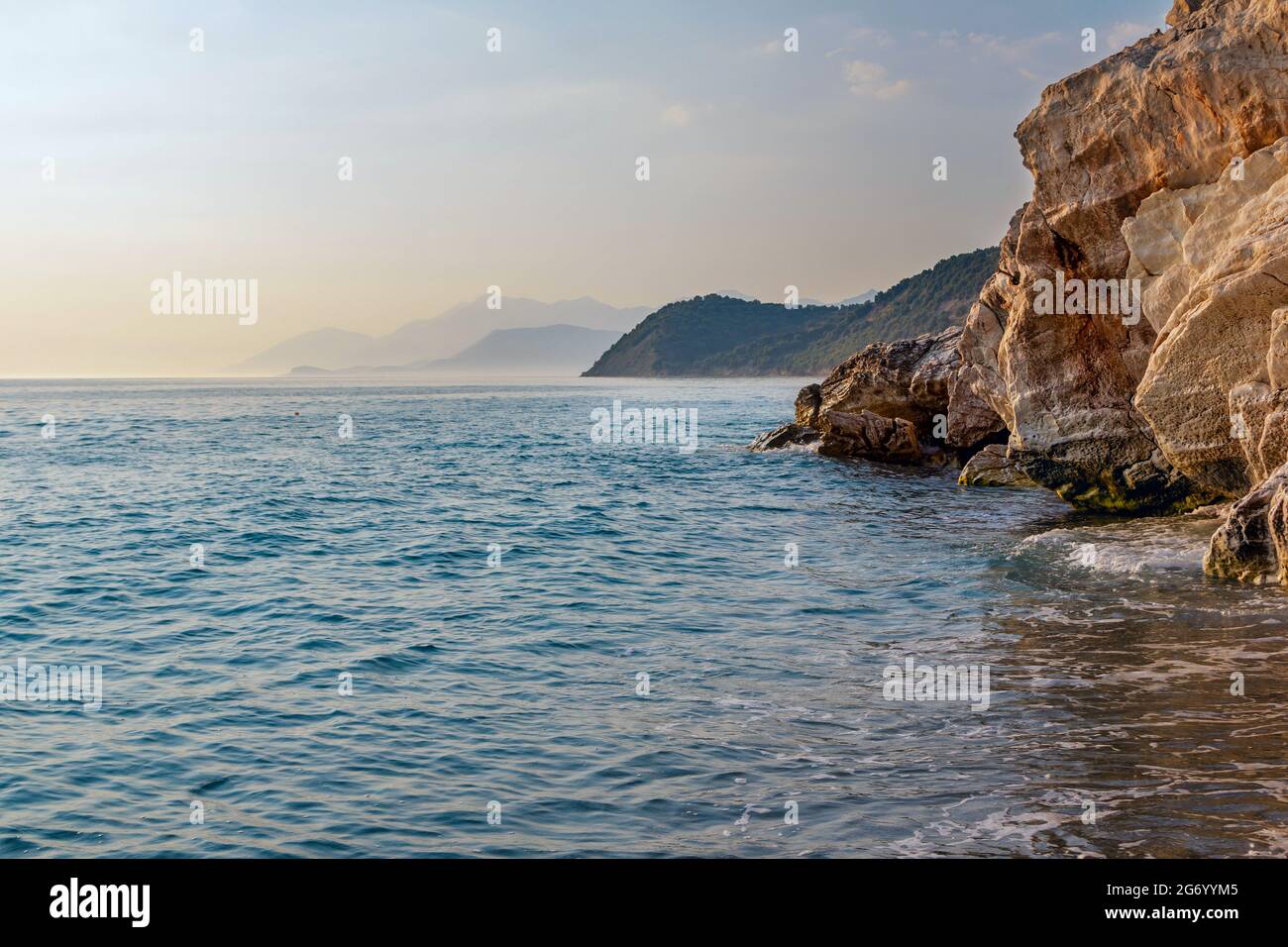 Beautiful landscape - beach in sunset sunlight - waving sea water ...