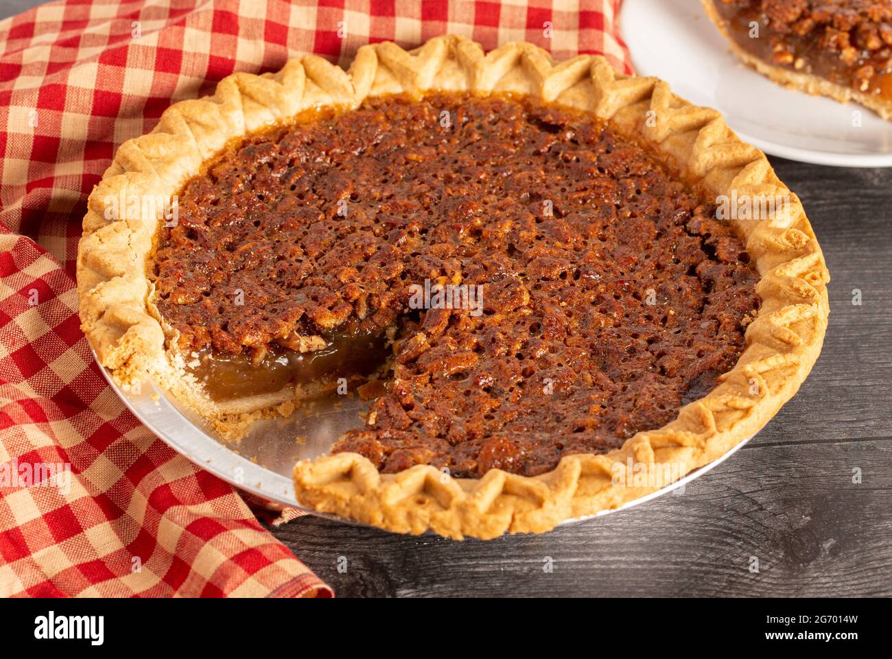 Traditional Pecan Pie with a Slice Cut Out Stock Photo - Alamy
