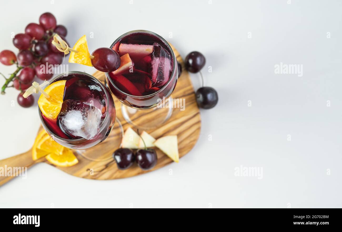 Two glasses of sangria with fruit decoration. Traditional Spanish drink ...