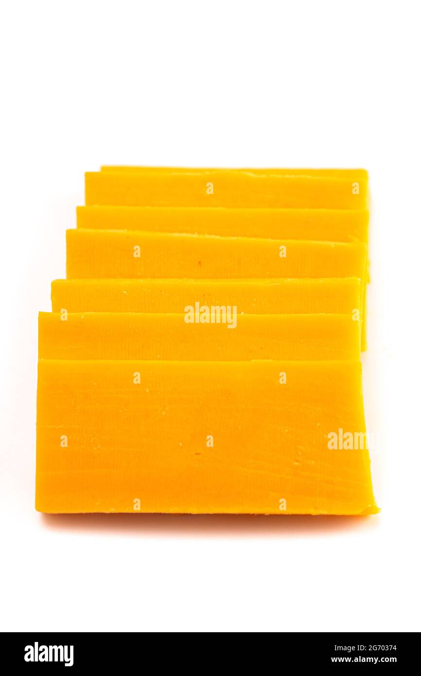 Rectangle Slices of Sharp Cheddar Cheese Isolated on a White Background ...