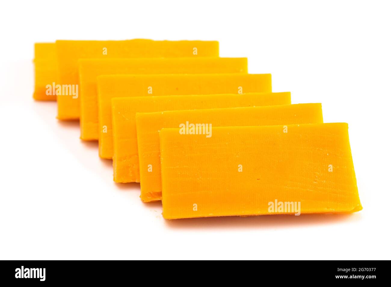 Rectangle Slices of Sharp Cheddar Cheese Isolated on a White Background ...