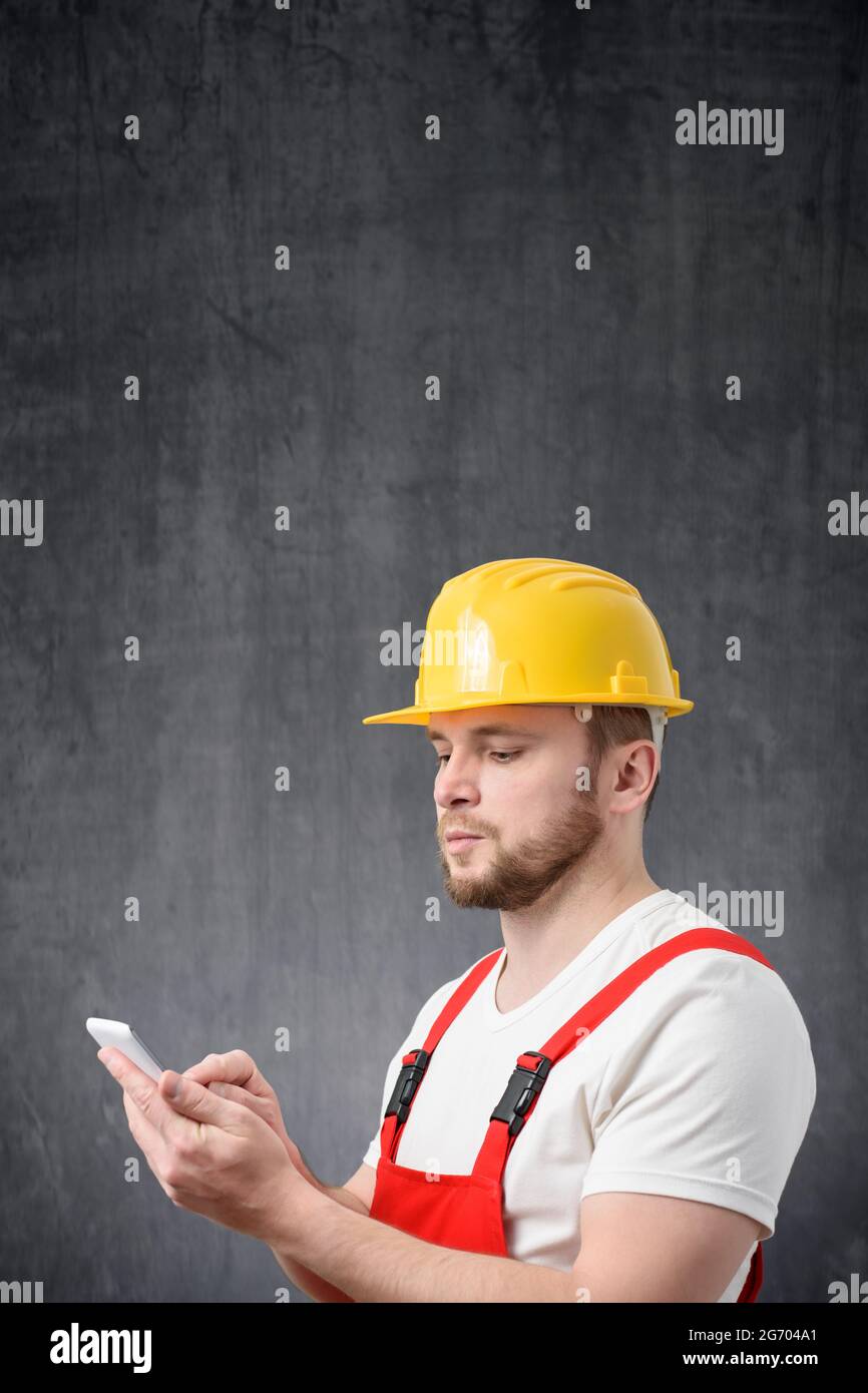 Construction worker using cell phone hi-res stock photography and ...