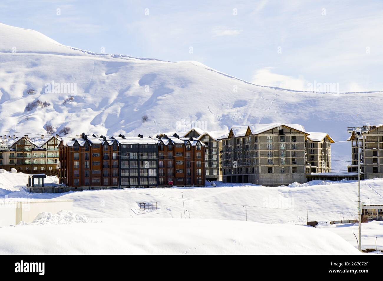 Beautiful view of snowy mountain landscapes and hostels in Gudauri ...