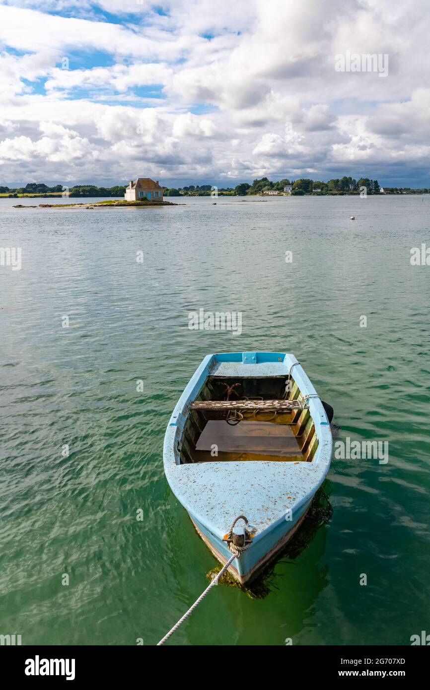 The house of Saint-Cado in Brittany, on the Etel river, with a blue row ...