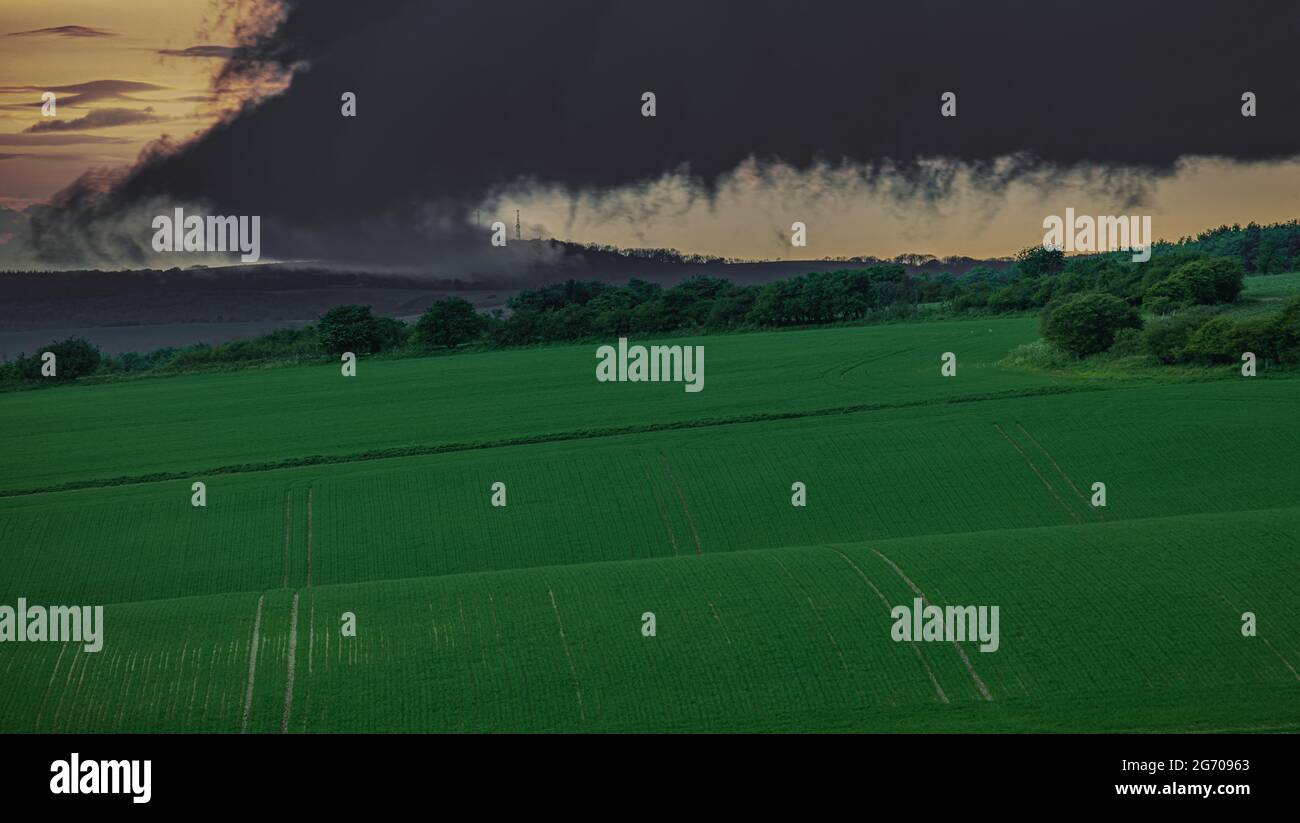 Aerial view of green fields on a stormy day with gray clouds Stock ...