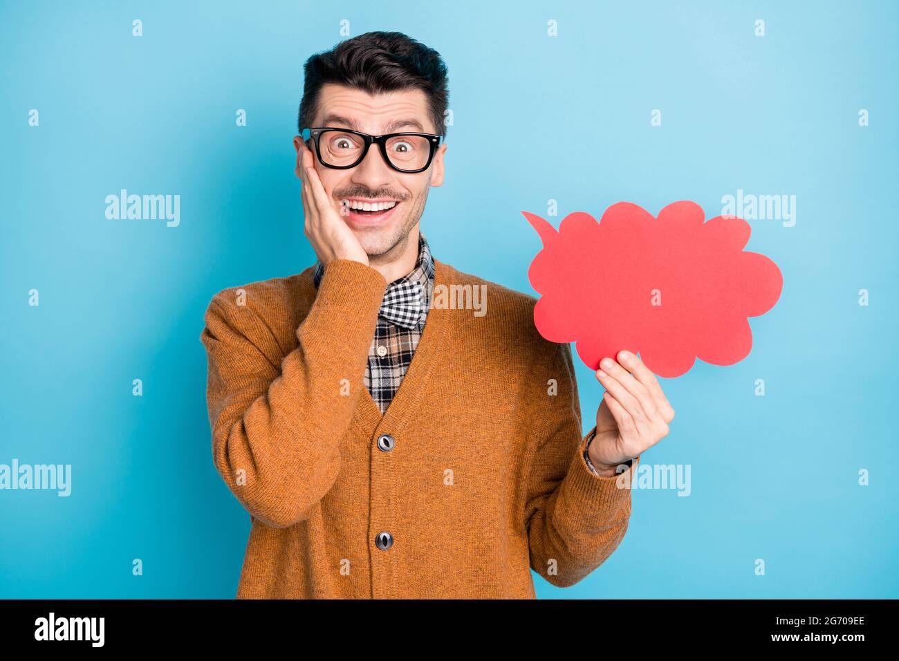 Photo Of Amazed Happy Young Man Hold Cloud Hand Cheekbone Wear Plaid