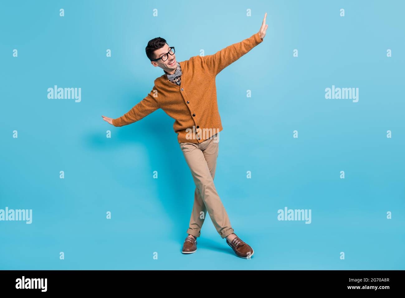 Full length photo of charming happy funky man dance good mood isolated ...