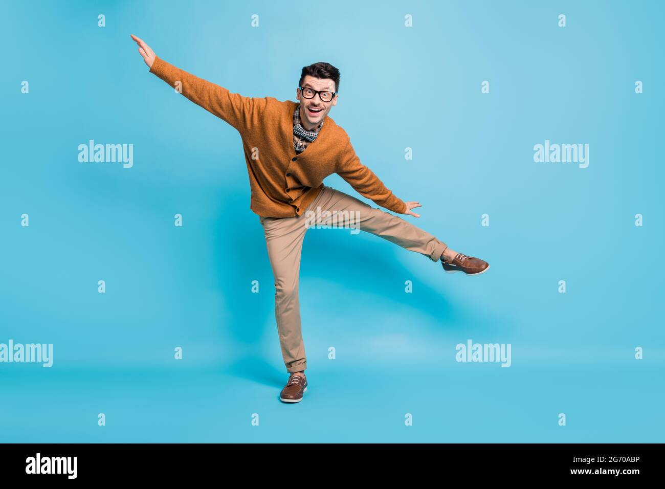 Full body photo of funky happy cheerful man make place wings dance ...