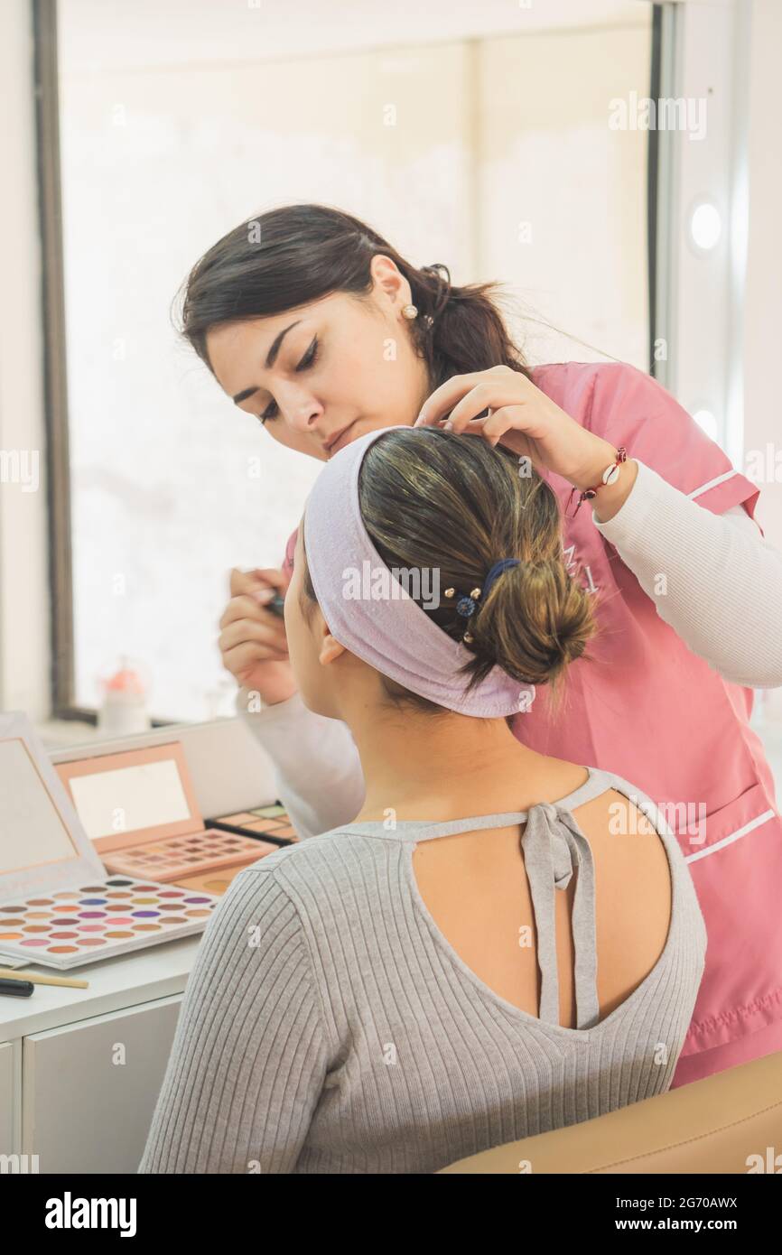 Young woman getting ready to put on makeup for a special event Stock ...