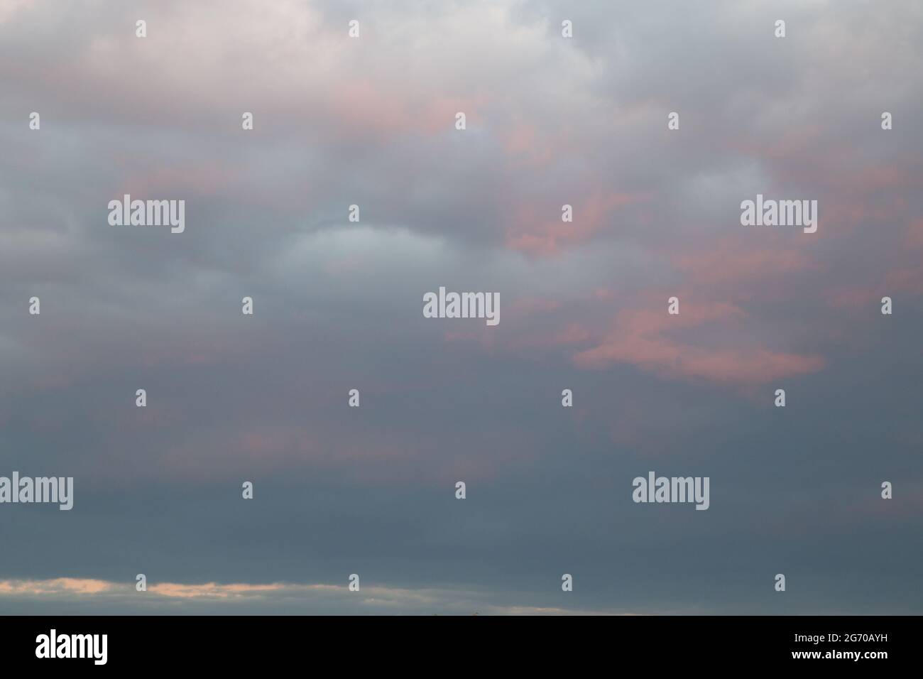 Sunset sky with yellow orange clouds - contrast between warm and cold ...
