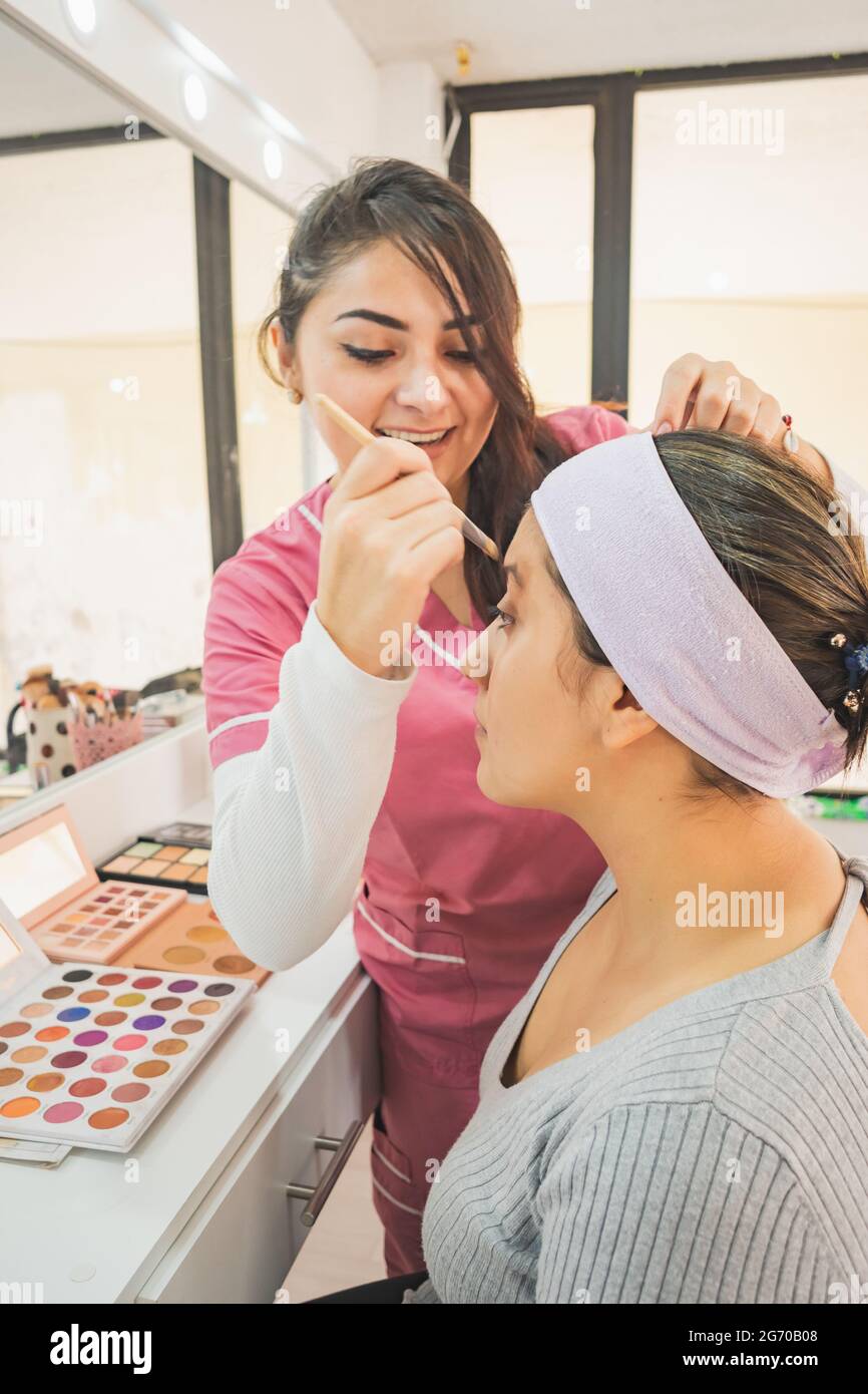 Young woman getting ready to put on makeup for a special event Stock Photo - Alamy