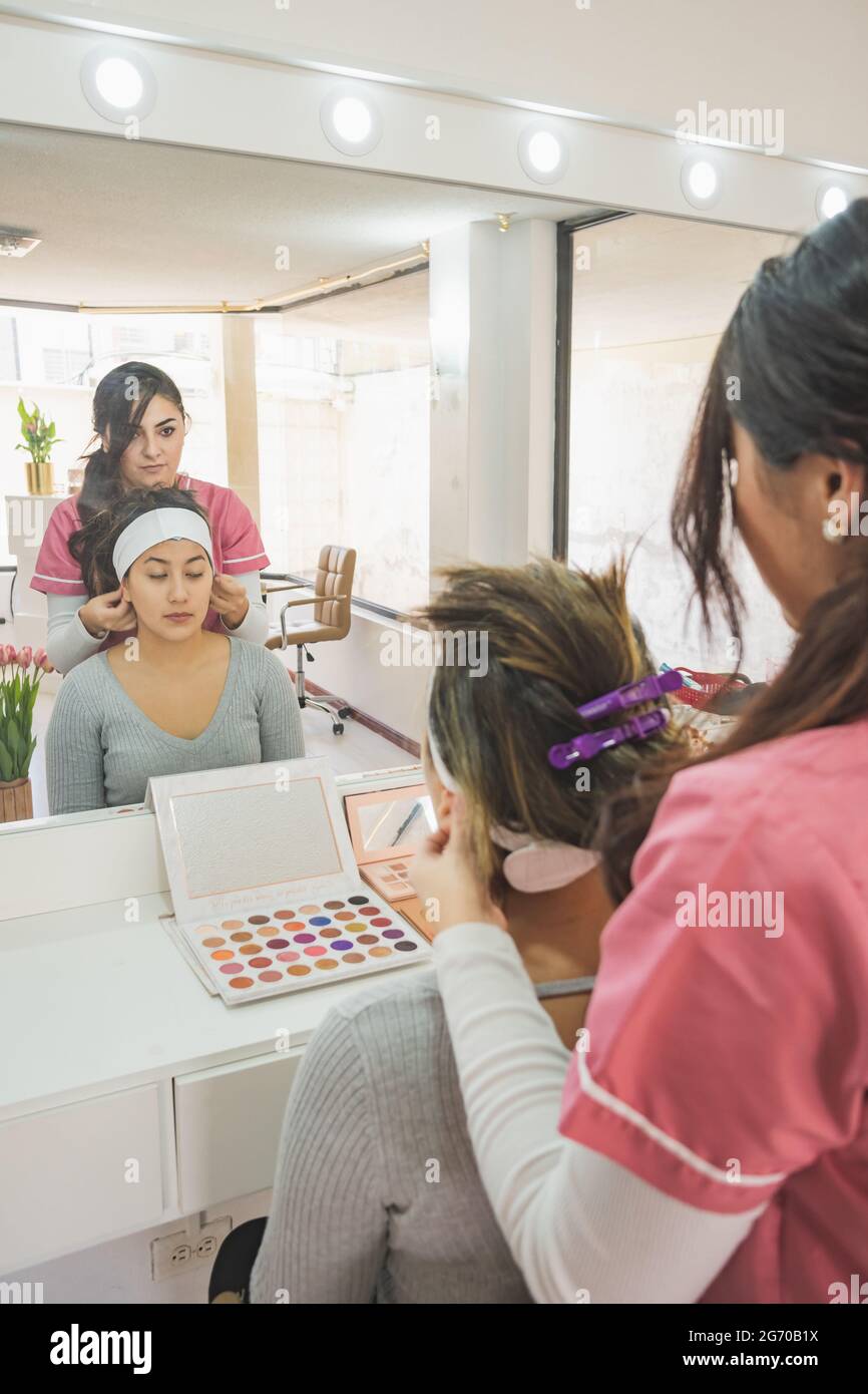 Young woman getting ready to put on makeup for a special event Stock ...