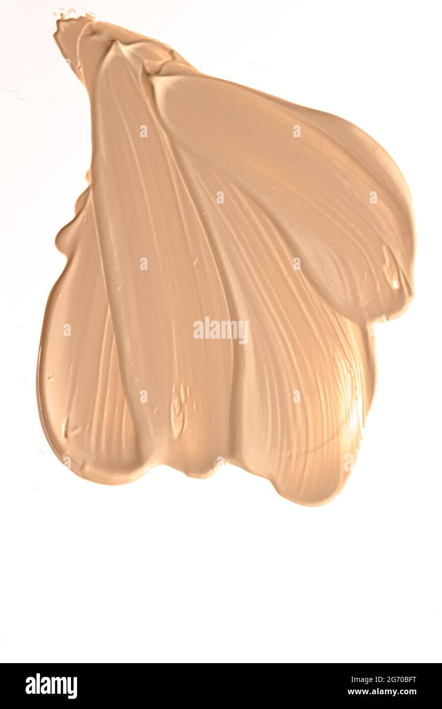 Beige beauty cosmetic texture isolated on white background, smudged ...