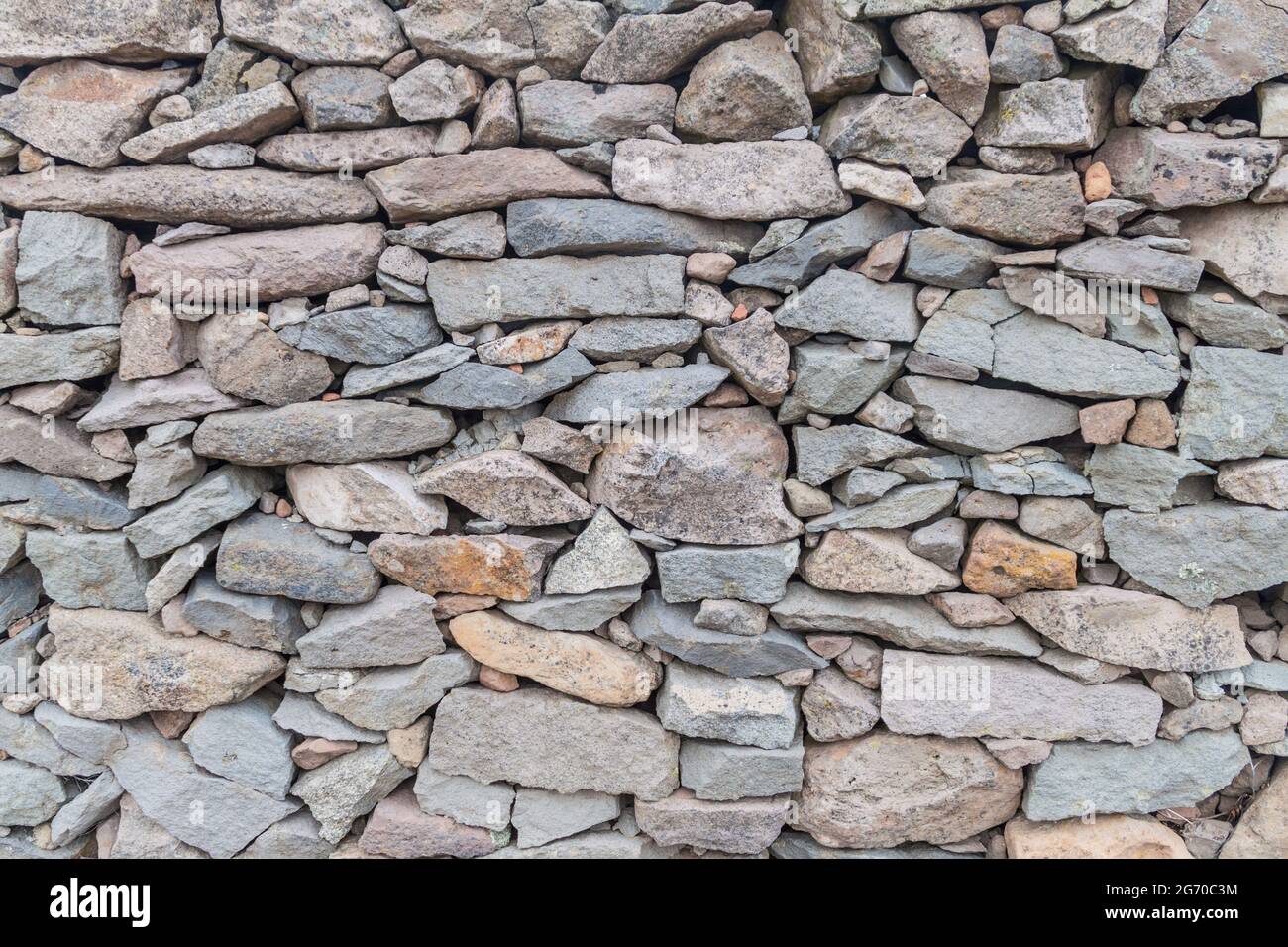 Detail of a stone wall Stock Photo - Alamy